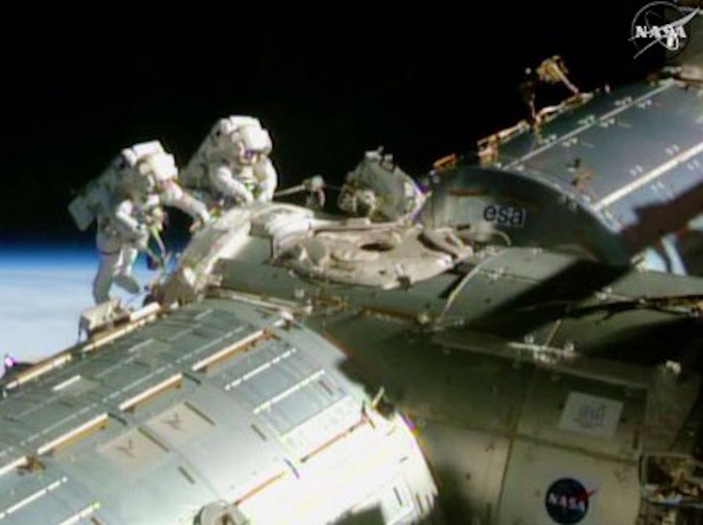 Astronauts perform cable installation on International Space Station ...
